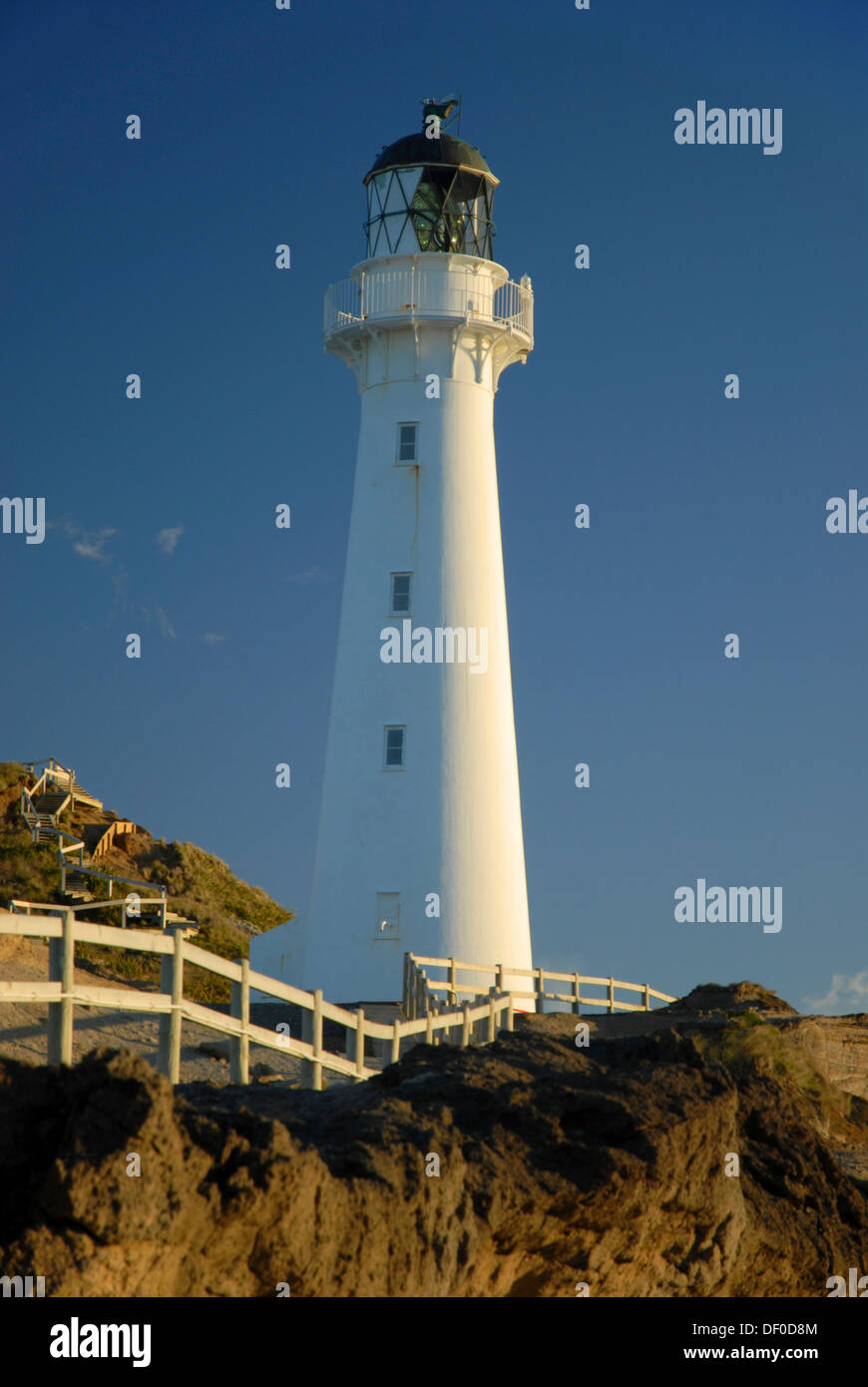 The lighthouse at Castle Point at the Wairarapa Coast illuminated by ...