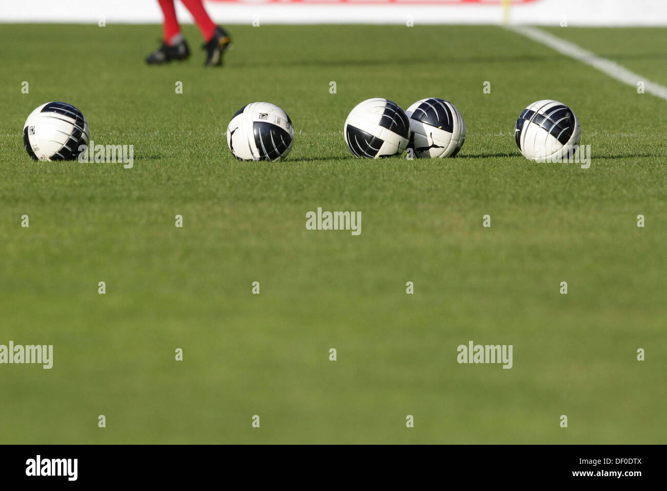 Footballs on a pitch Stock Photo - Alamy