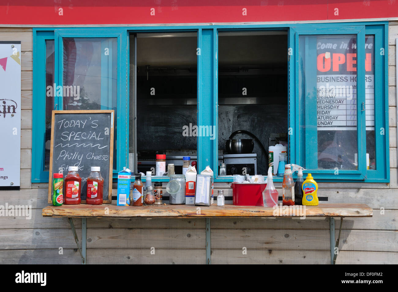 Fast food window with Todays Special chalk board and condiments Stock ...