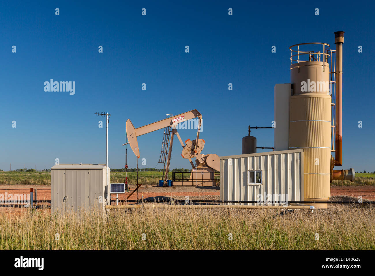 Oil pumpers in the Bakken play oil fields near Williston, North Dakota ...