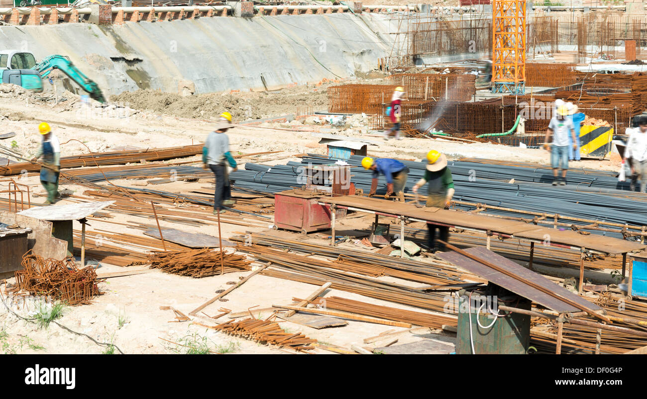 building under construction with workers Stock Photo - Alamy
