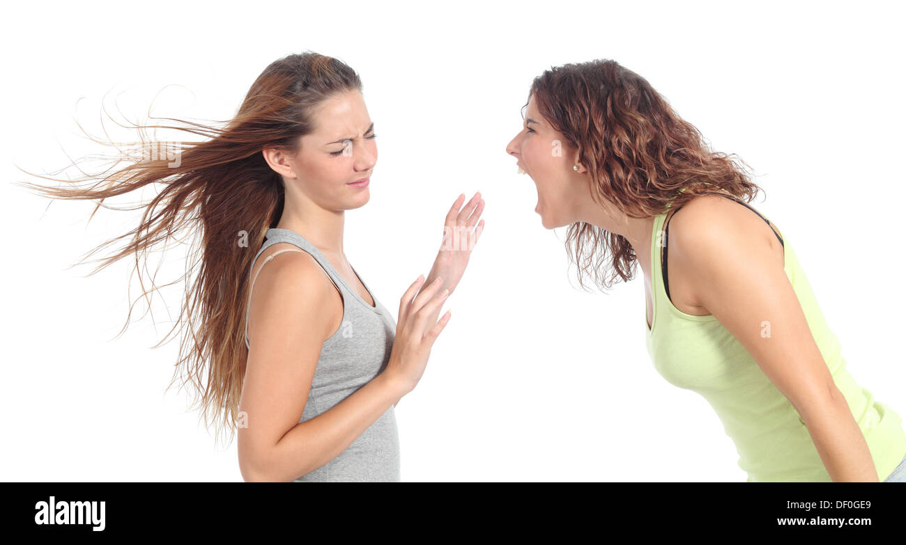Woman shouting angry to another one isolated on a white background ...