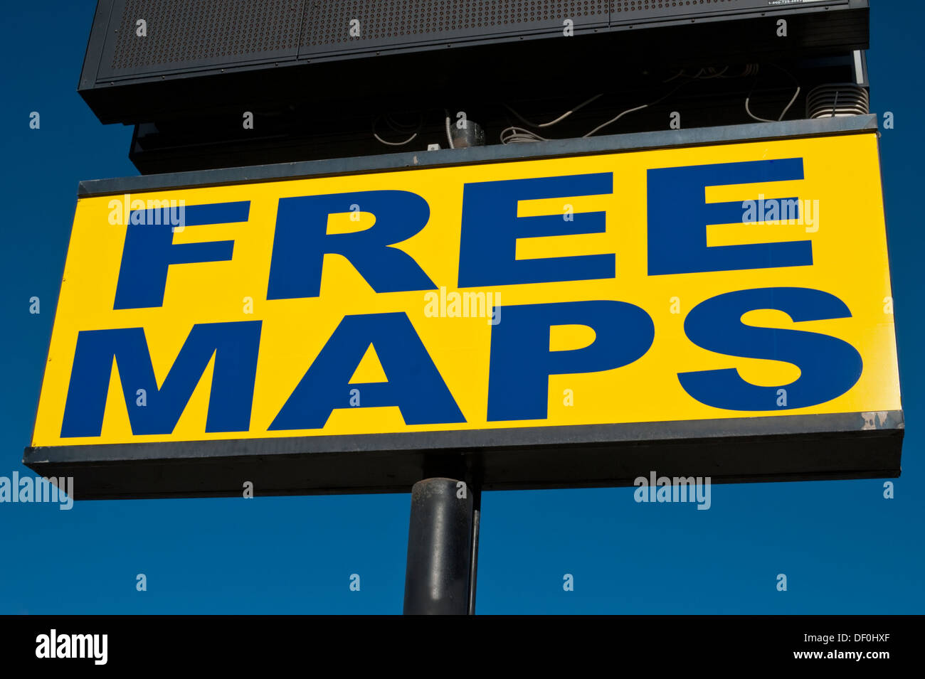 A sign that says, "Free Maps" invites visitors into a real estate ...