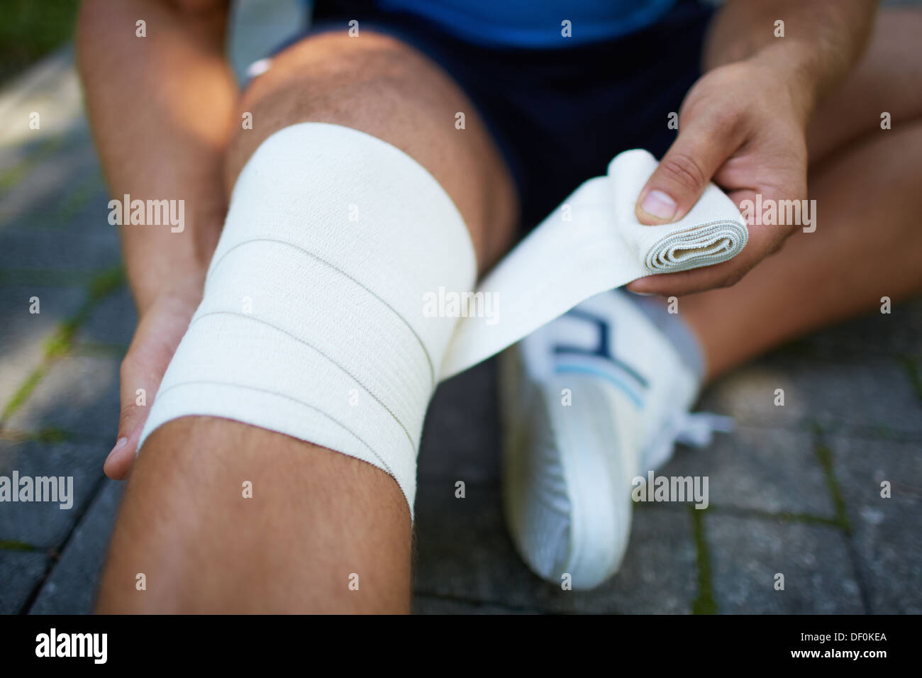 Bandaging leg hi-res stock photography and images - Alamy