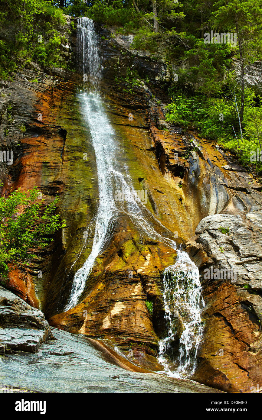 Beautiful view of a waterfall in the mountains going down the steep ...