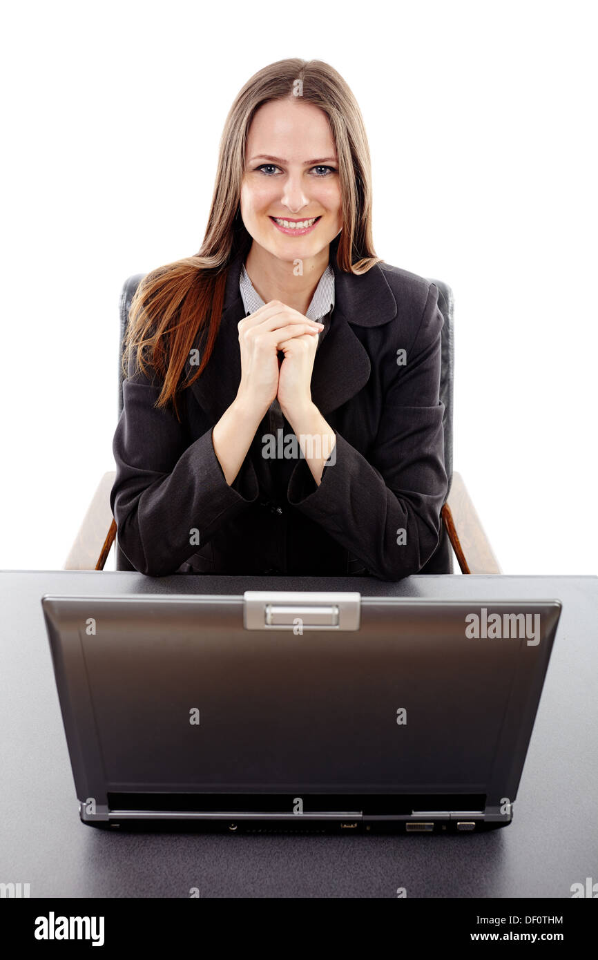 Happy successful young caucasian businesswoman at her desk with a ...