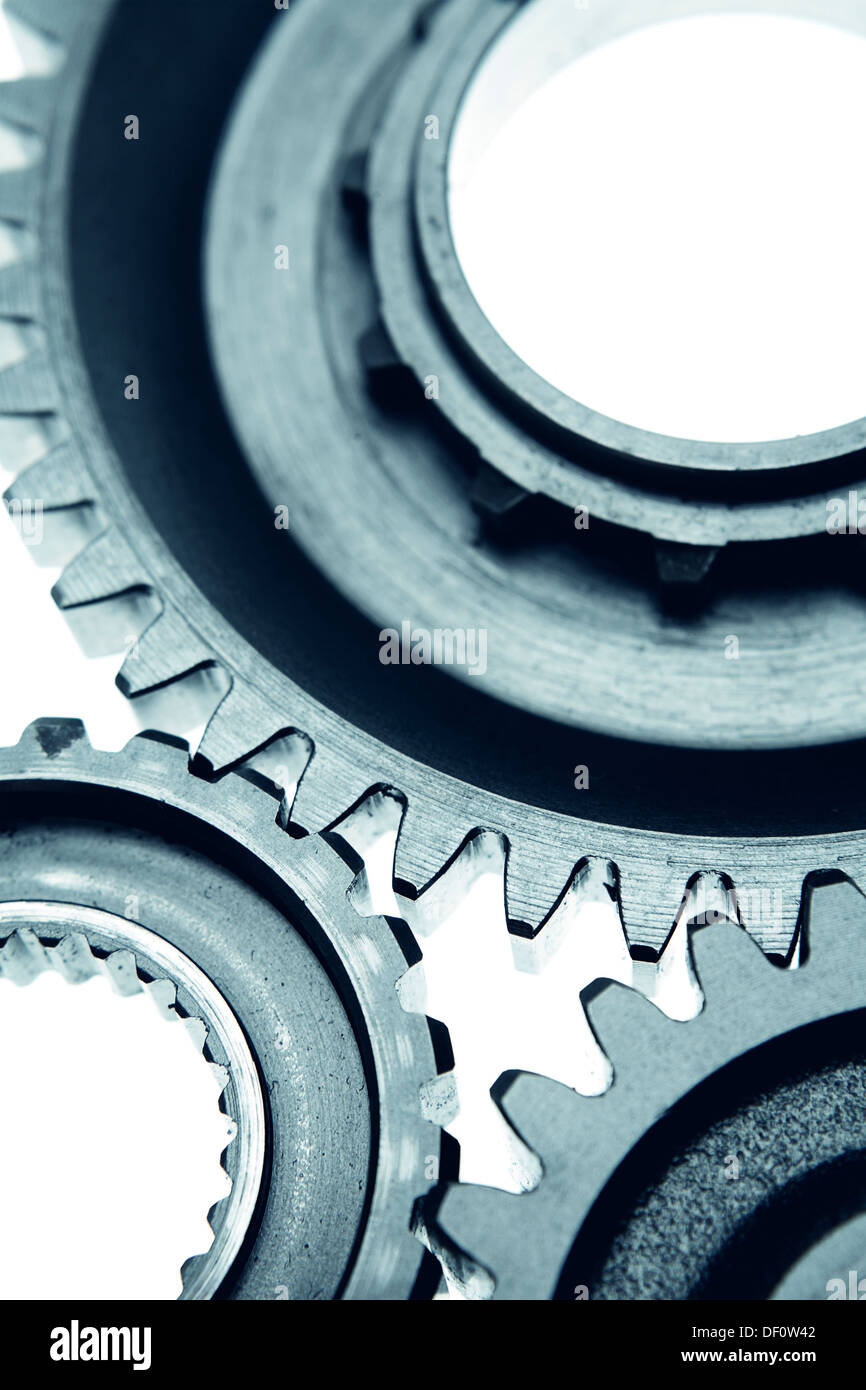 Closeup of three metal cog gears Stock Photo - Alamy