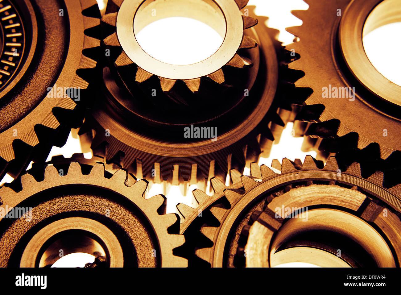 Metal cog wheels bonding together Stock Photo - Alamy