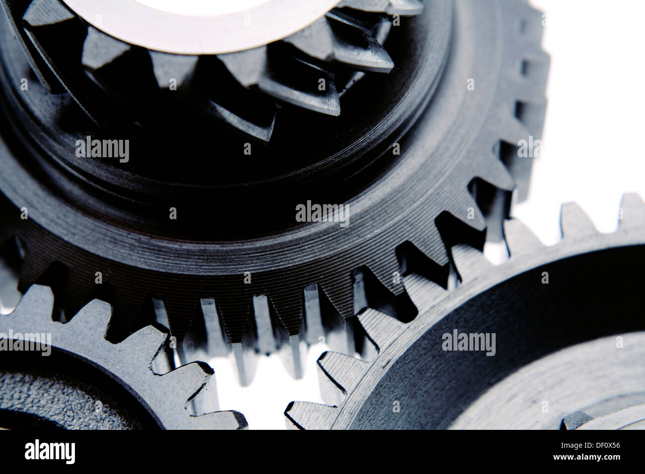 Closeup of three metal cog gears Stock Photo - Alamy