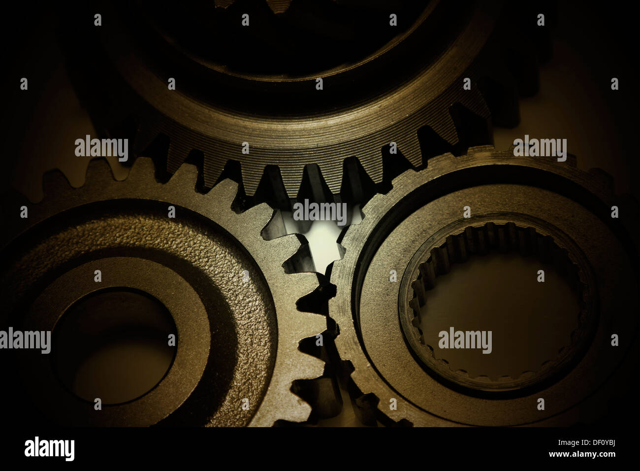 Closeup of three metal cog gears Stock Photo - Alamy