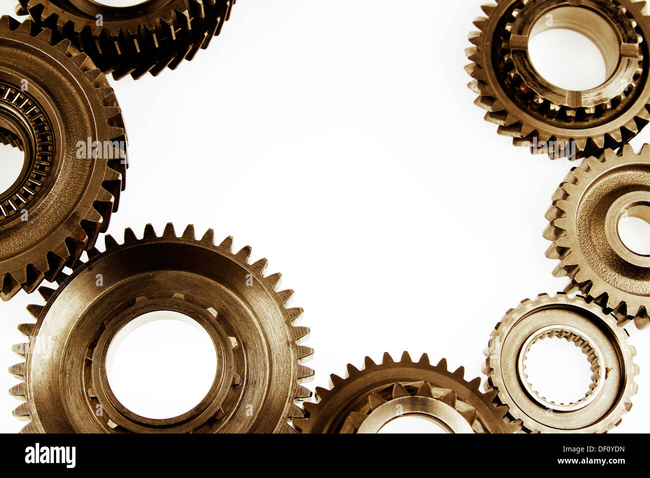 Metal cog wheels bonding together Stock Photo - Alamy