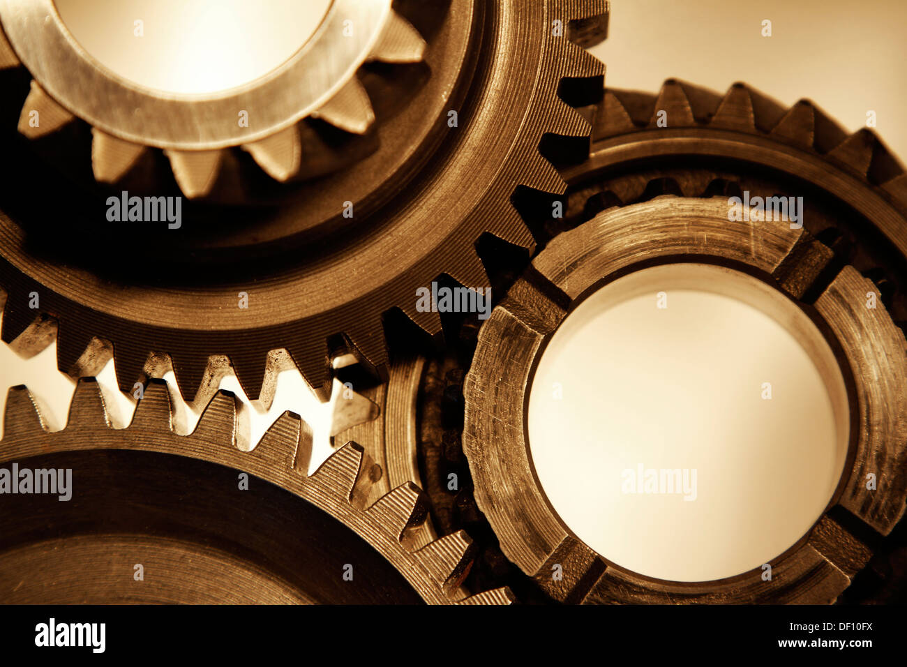 Closeup of three metal cog gears Stock Photo - Alamy
