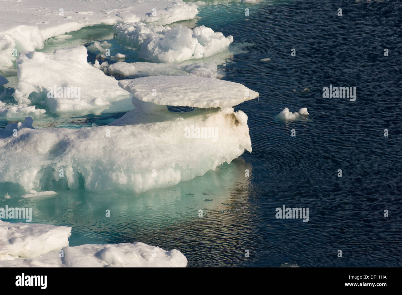 Floating drift ice reflected in deep blue water, from an icebreaker ...