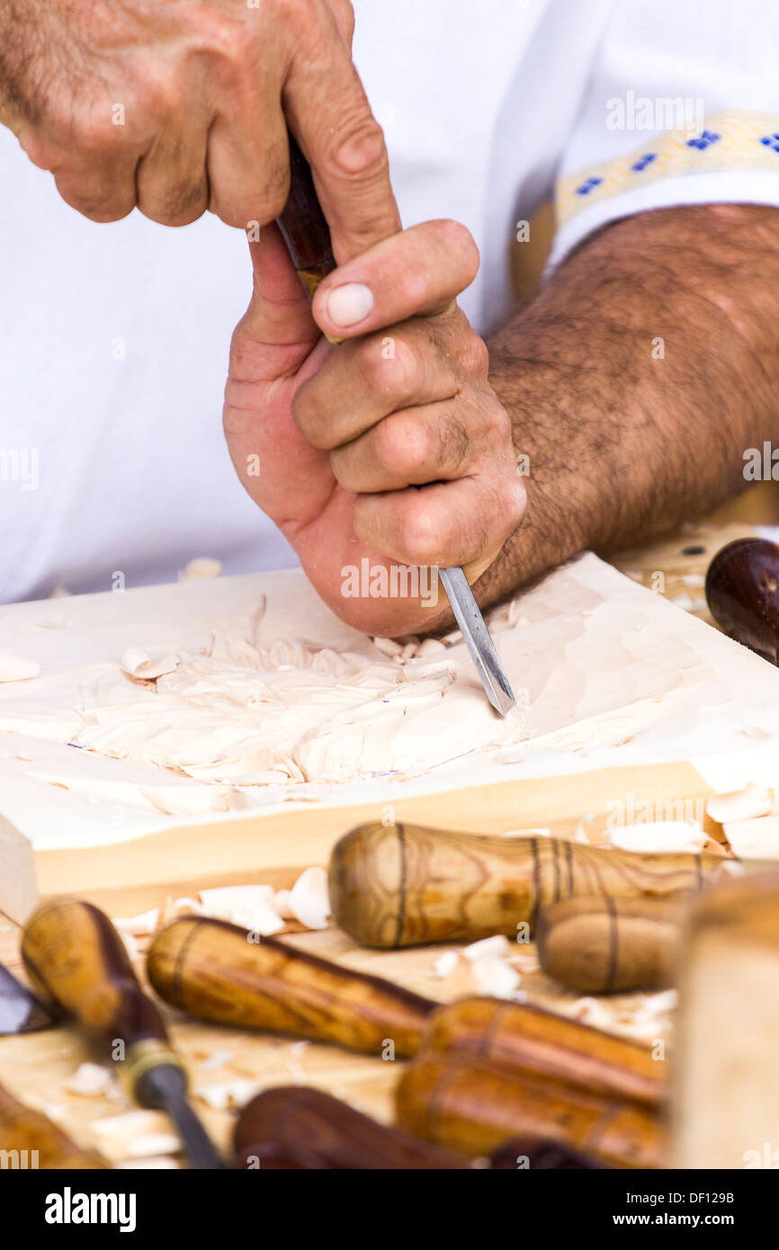 Traditional craftsman carving wood Stock Photo - Alamy
