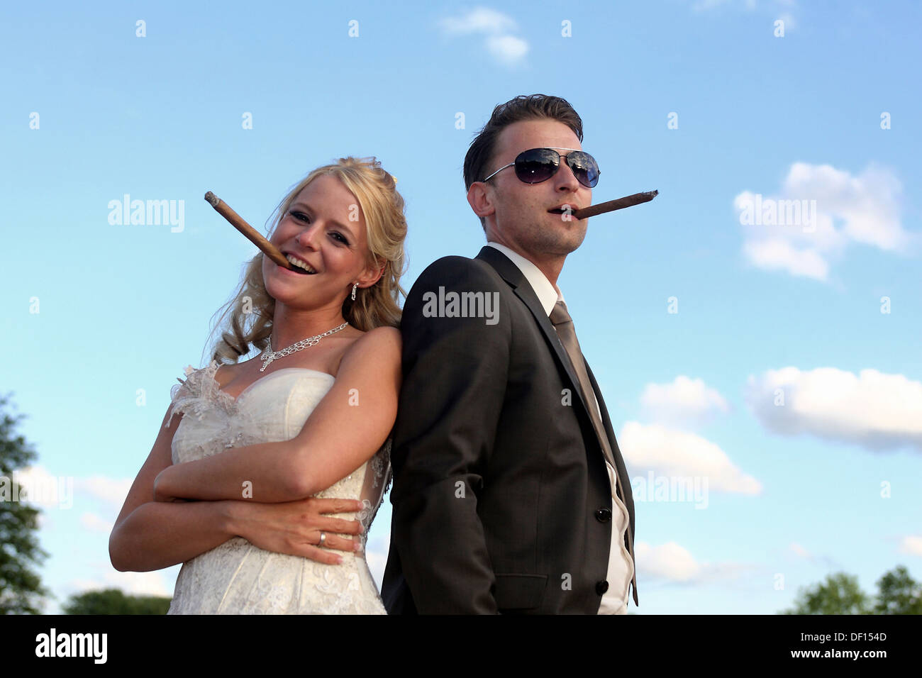 Berlin, Germany, a bride and groom posing with cigar Stock Photo - Alamy