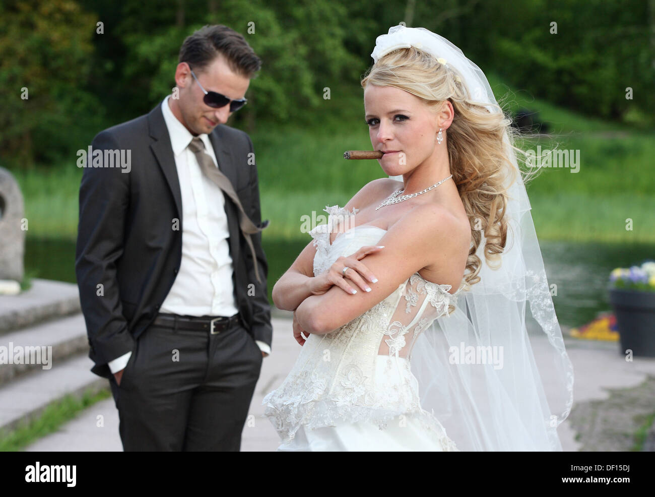 Berlin, Germany, a bride and groom posing with cigar Stock Photo - Alamy