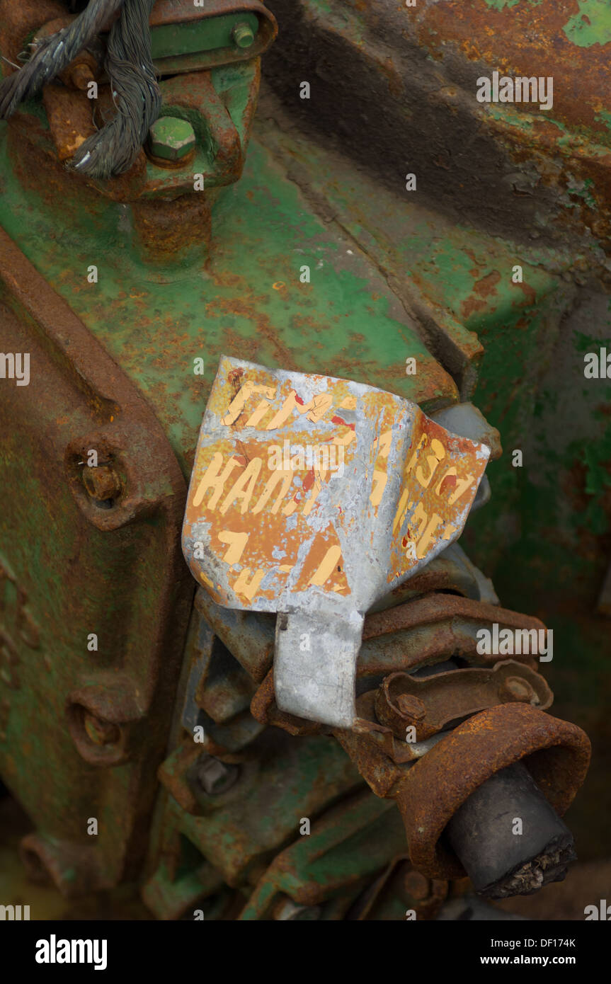 Rusting machinery with hand painted sign at the deserted Soviet Russian ...