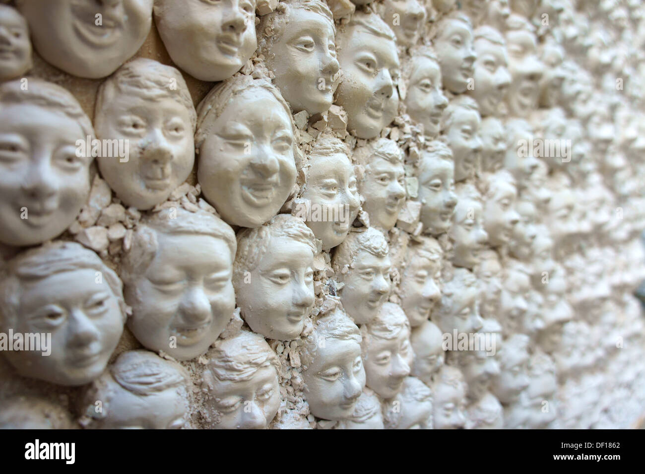 Many heads of plaster on a door, DOOR LOCK, decoration in Funchal ...