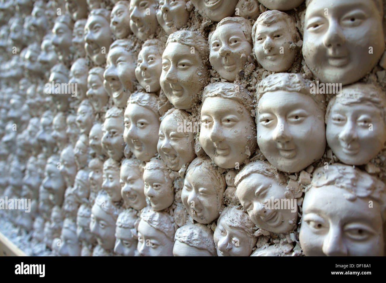 Many heads of plaster on a door, DOOR LOCK, decoration in Funchal ...