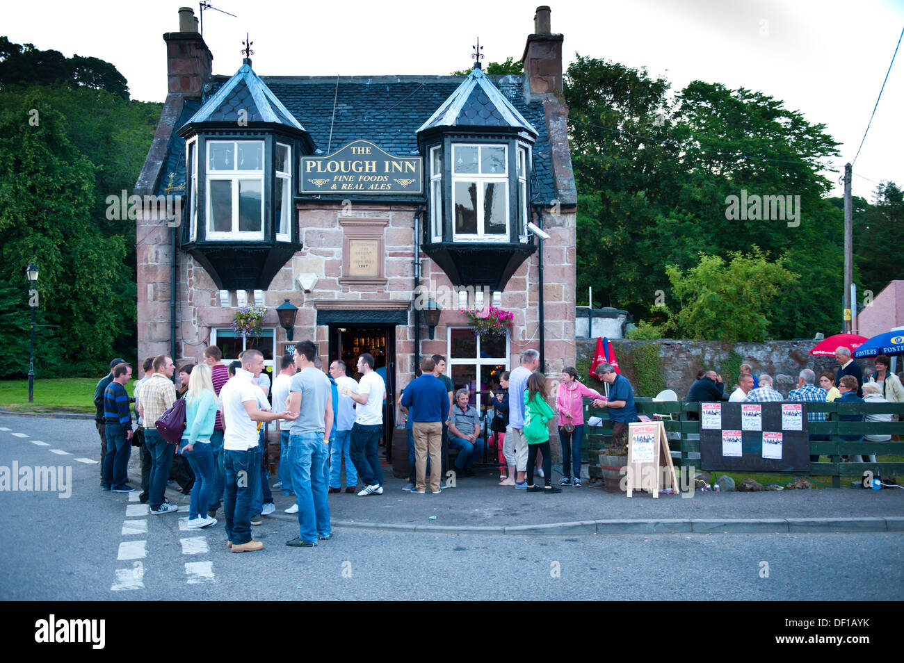 People gathering outside pub Stock Photo - Alamy