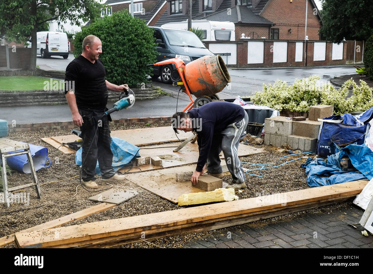 Builders on a construction site Stock Photo - Alamy