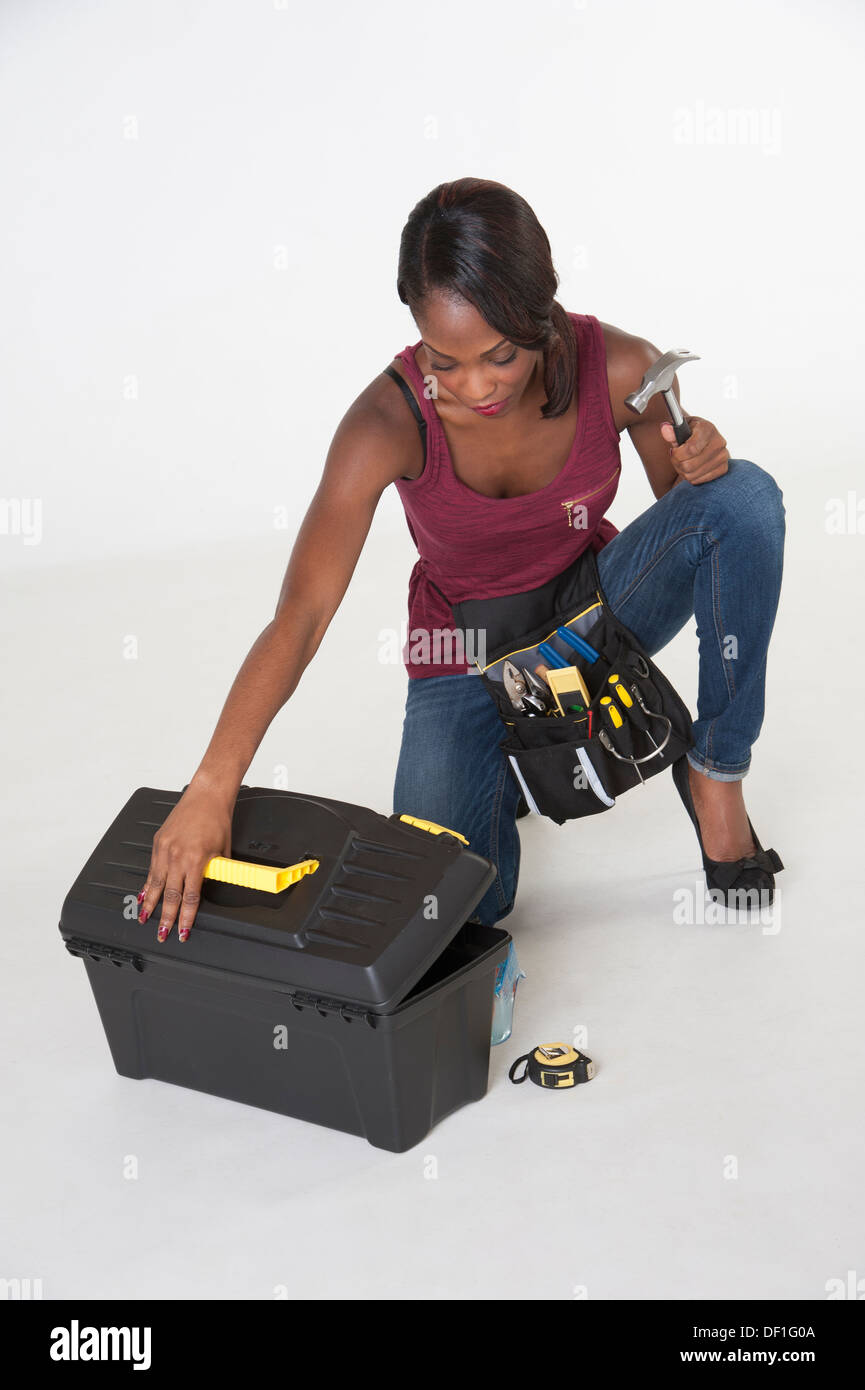 Female worker with toolbox and tool belt Stock Photo - Alamy
