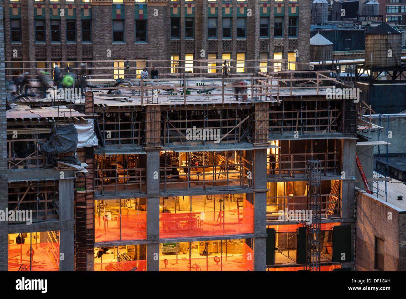 Highrise Building Construction Site with tradesmen, Dusk, NYC Stock ...
