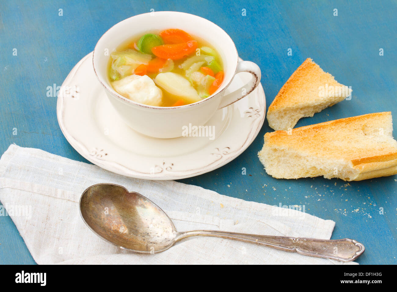 Fish soup with silver spoon Stock Photo - Alamy