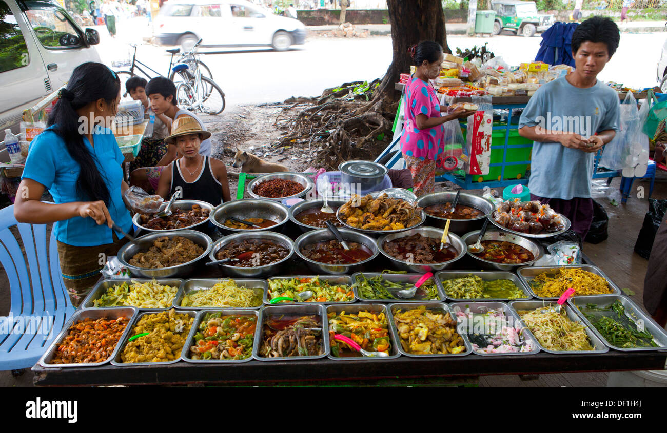 A woman sell food at a market in Yangon, Burma Stock Photo - Alamy
