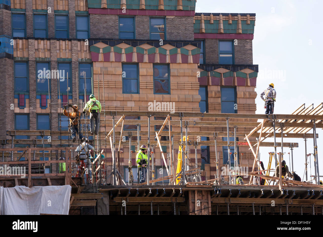 High-rise Building Construction Site with Tradesmen Stock Photo - Alamy