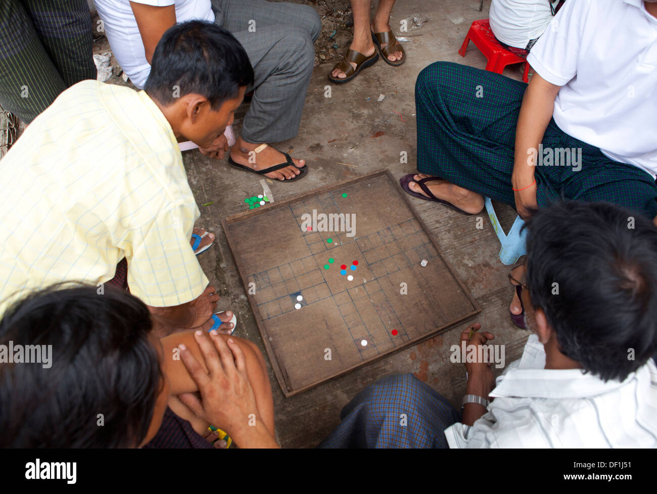 Men play a board game at a market in Yangon, Burma Stock Photo - Alamy