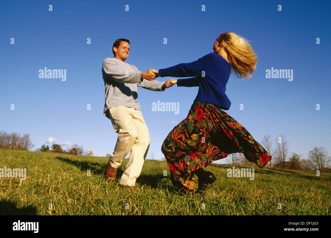 Woman twirling hair around hi-res stock photography and images - Alamy