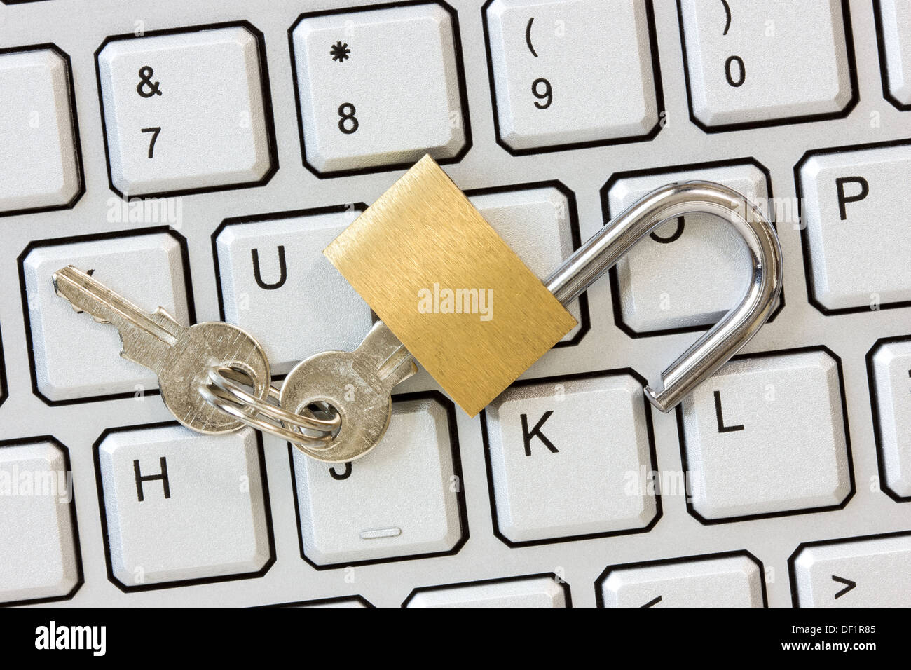 Unlocked padlock with a keys on the computer keyboard Stock Photo - Alamy