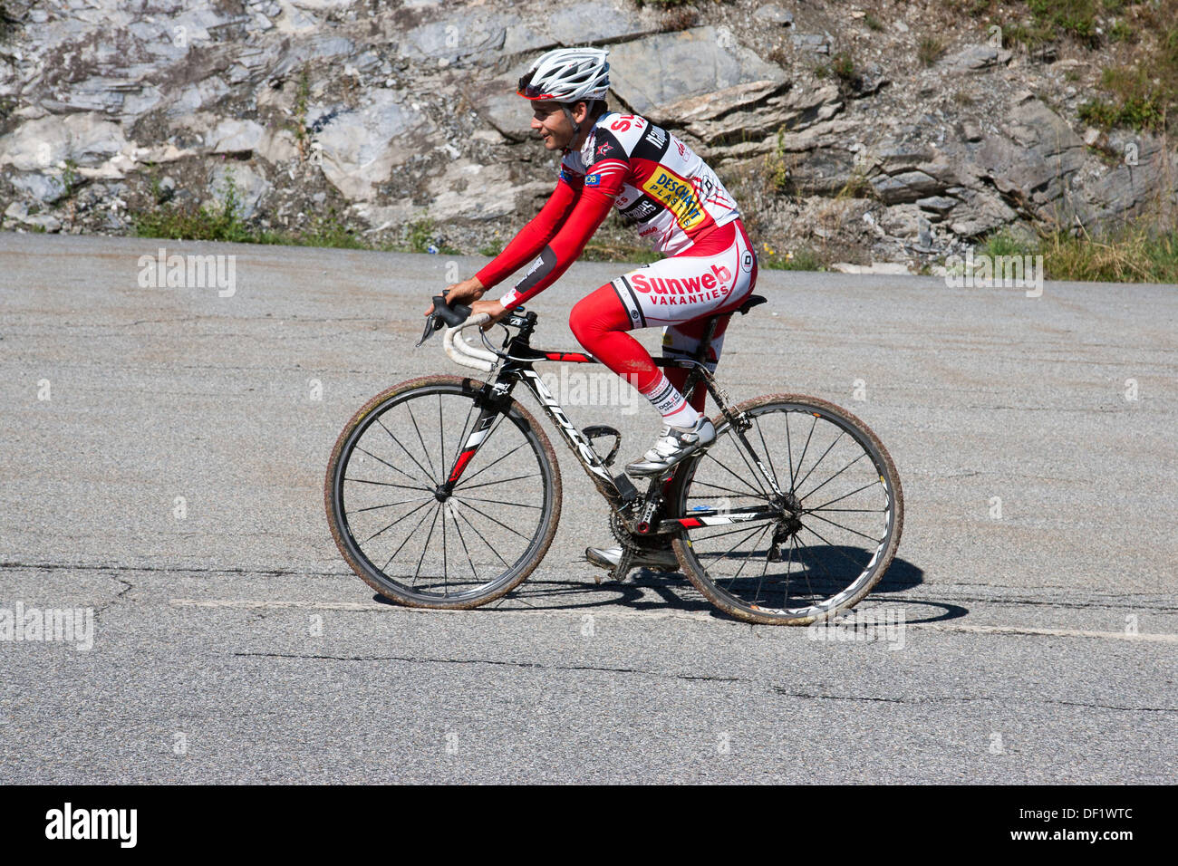 cyclist riding determined rock face pedaling pedal Stock Photo - Alamy