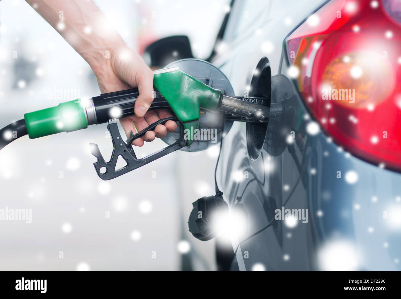 man pumping gasoline fuel in car at gas station Stock Photo - Alamy