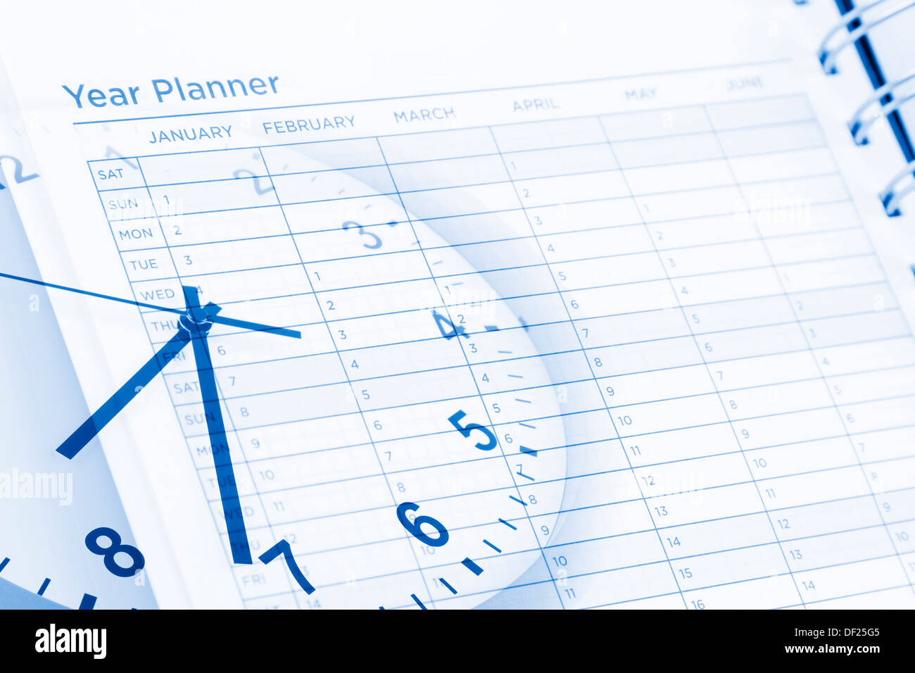 Clock face and year planner Stock Photo - Alamy