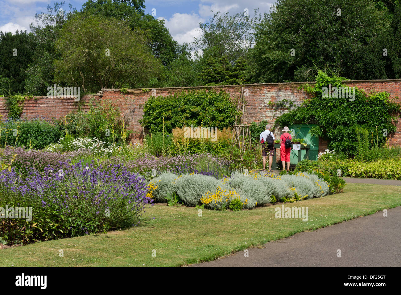 Two visitors admiring the planting, Walled Garden, Delapre Abbey ...