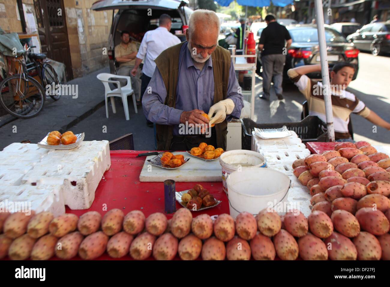 A man sells cactus pears in the street of the centre of Damascus, Syria ...