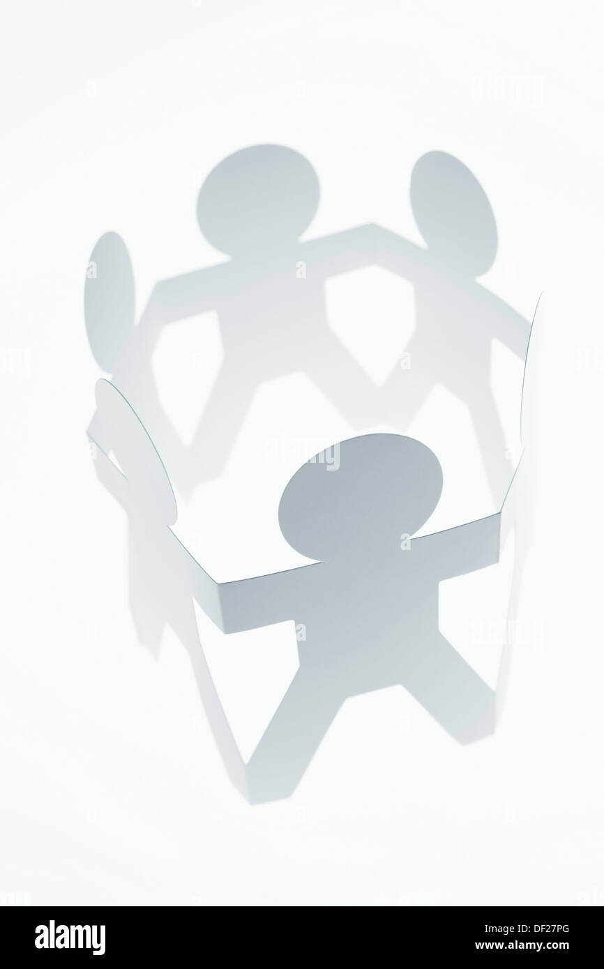 Team of paper doll people in a circle Stock Photo - Alamy