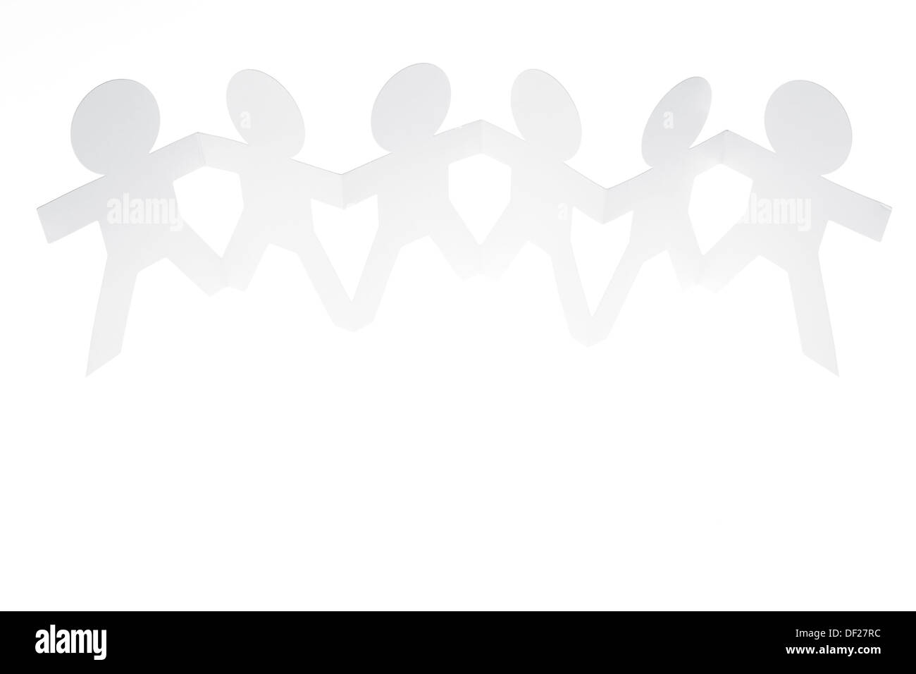 Team paper doll people Cut Out Stock Images & Pictures - Alamy