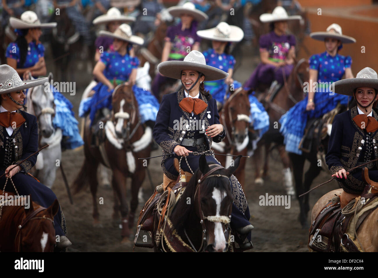 Female amazon riders ride their horses during an escaramuza fair at the ...
