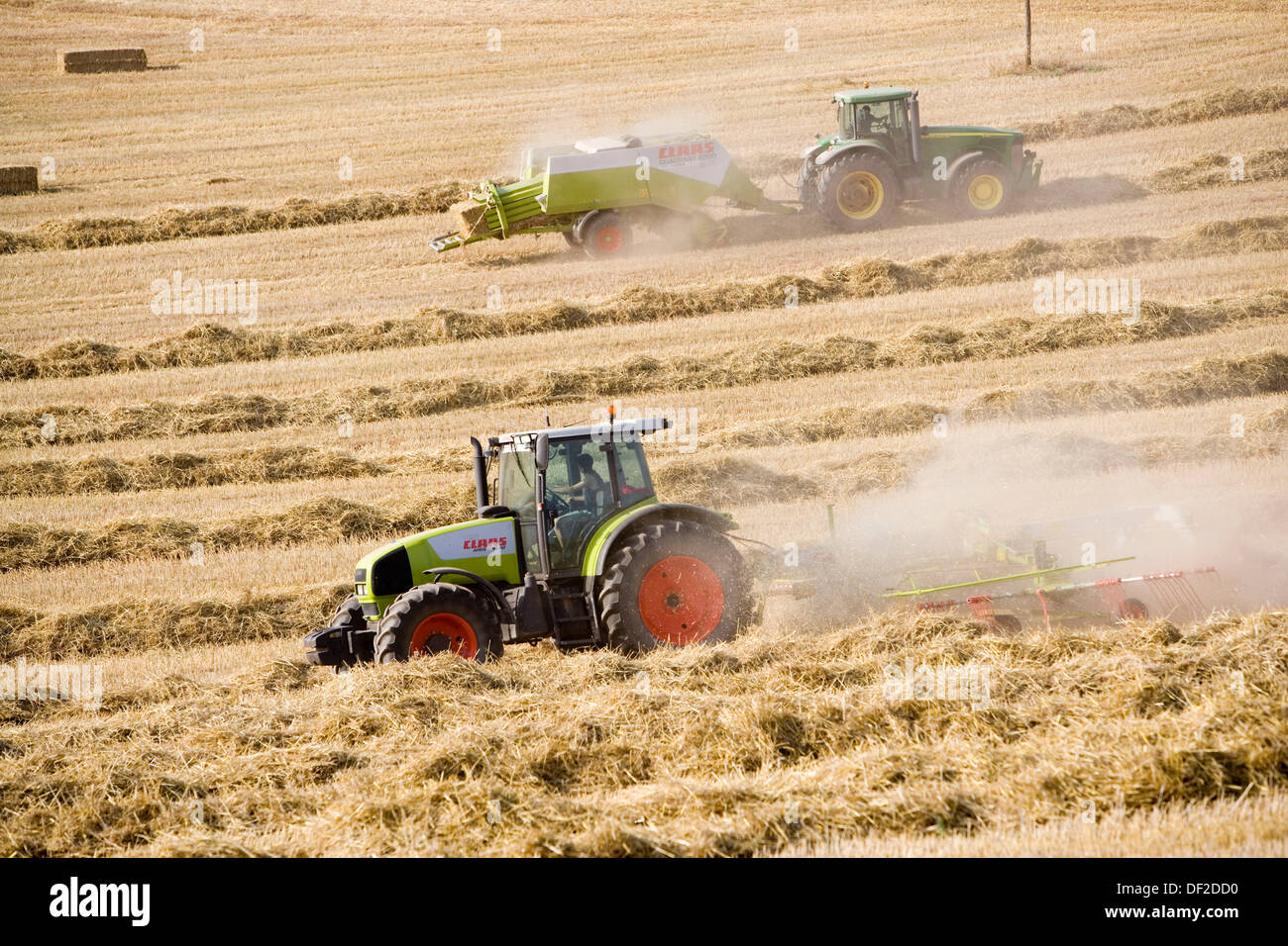 Agricultural machinery. Windrower and Pick-up baler. Harvesting of ...