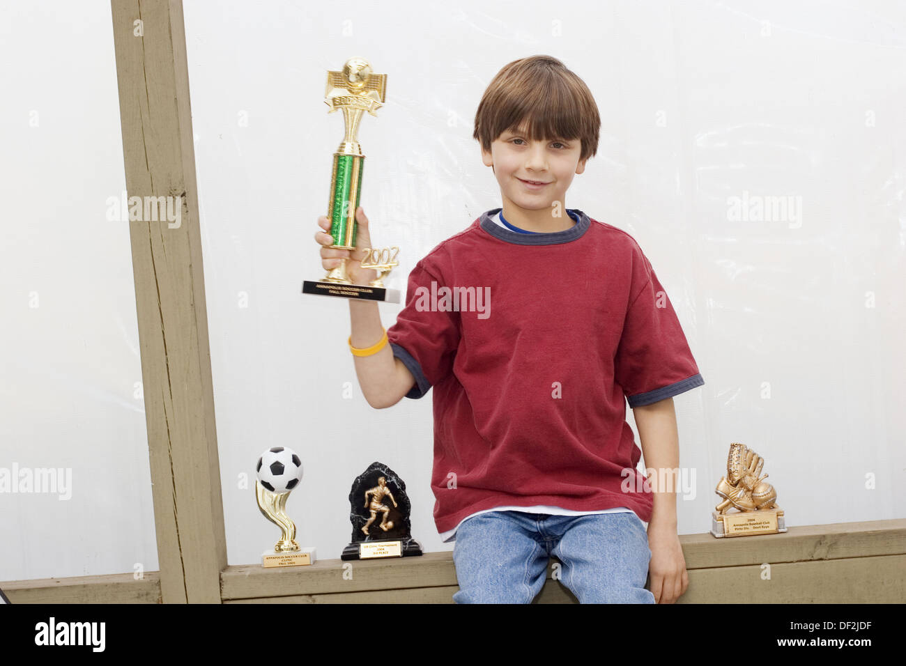 Boy trophies hi-res stock photography and images - Alamy