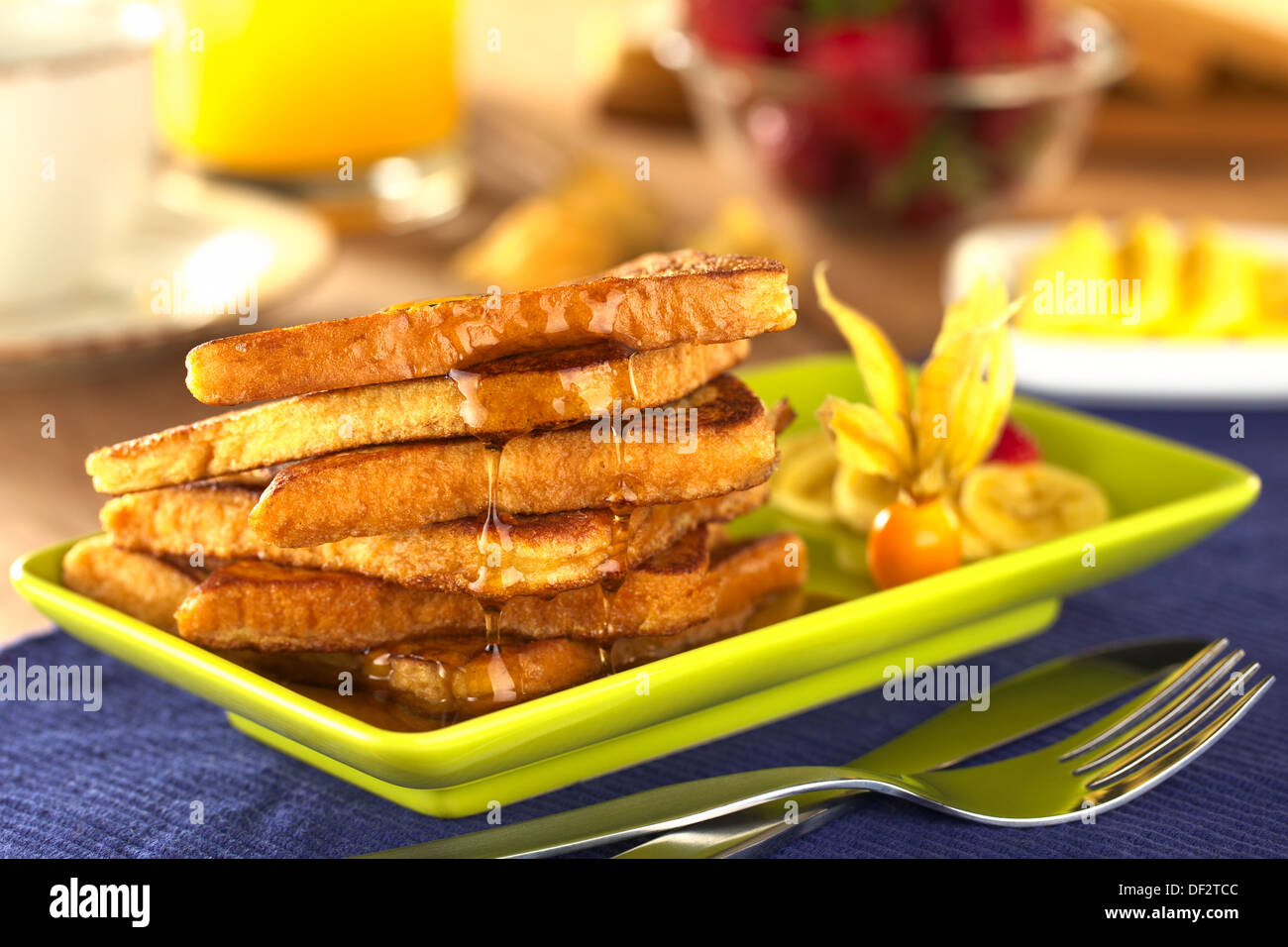 French toast with maple syrup and fruits (Selective Focus, Focus on the ...
