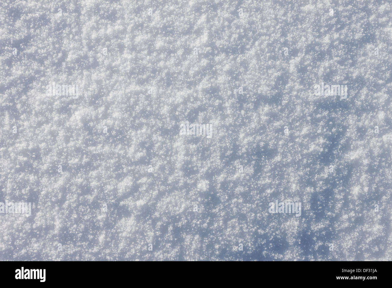 White frost snow toned in blue background Stock Photo - Alamy
