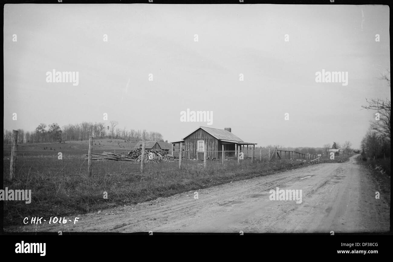 A historical photograph of Adkin's farmhouse, depicting an old rural ...