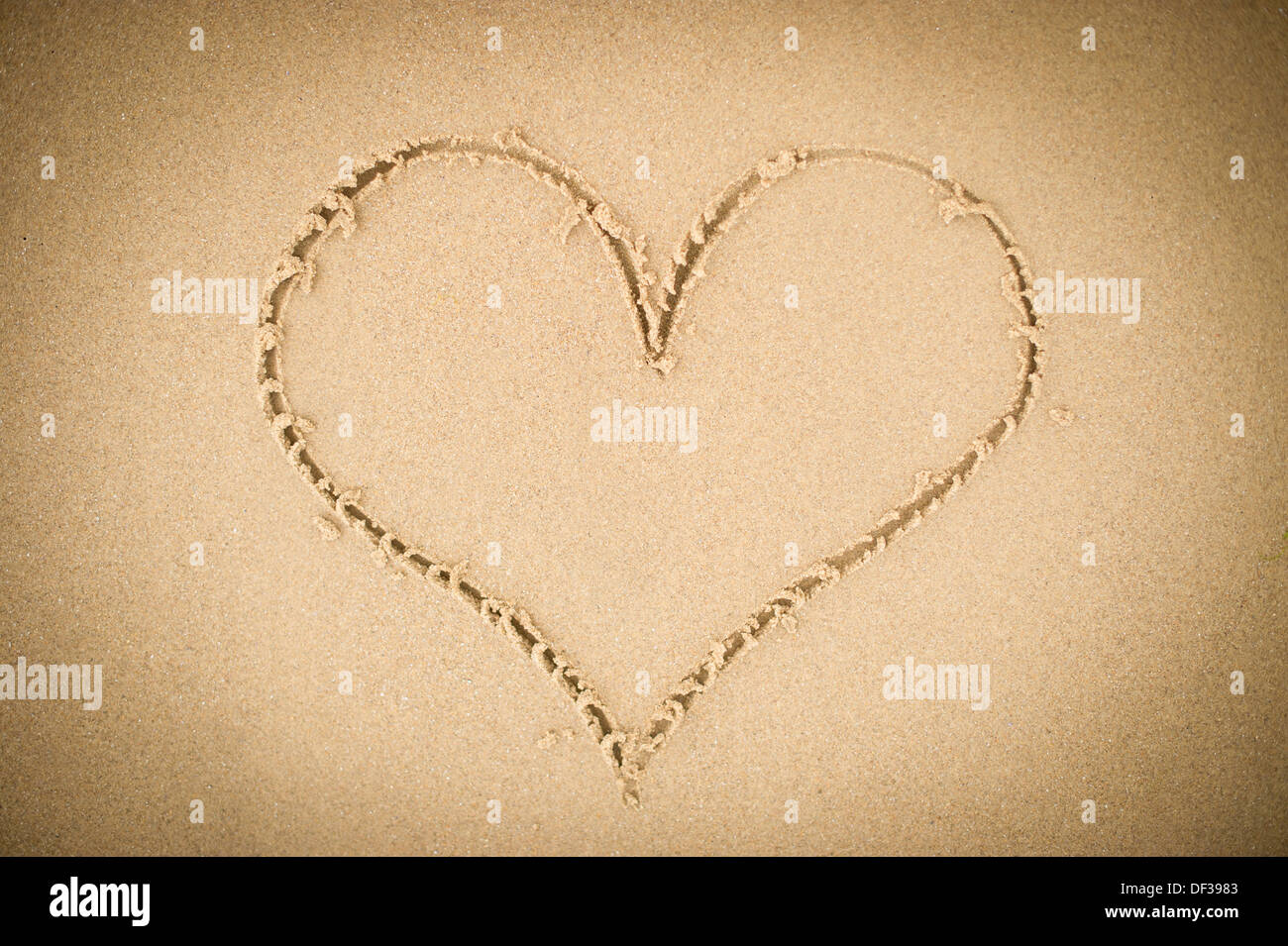 Heart shape drawn in sand hi-res stock photography and images - Alamy