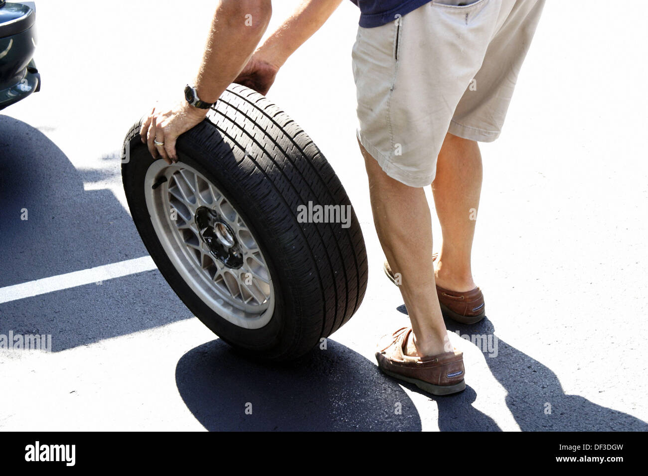 Rolling a tyre hi-res stock photography and images - Alamy