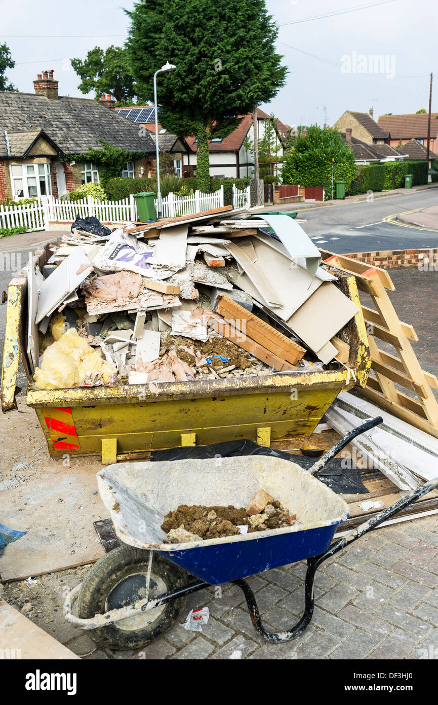 A skip full of rubble Stock Photo - Alamy
