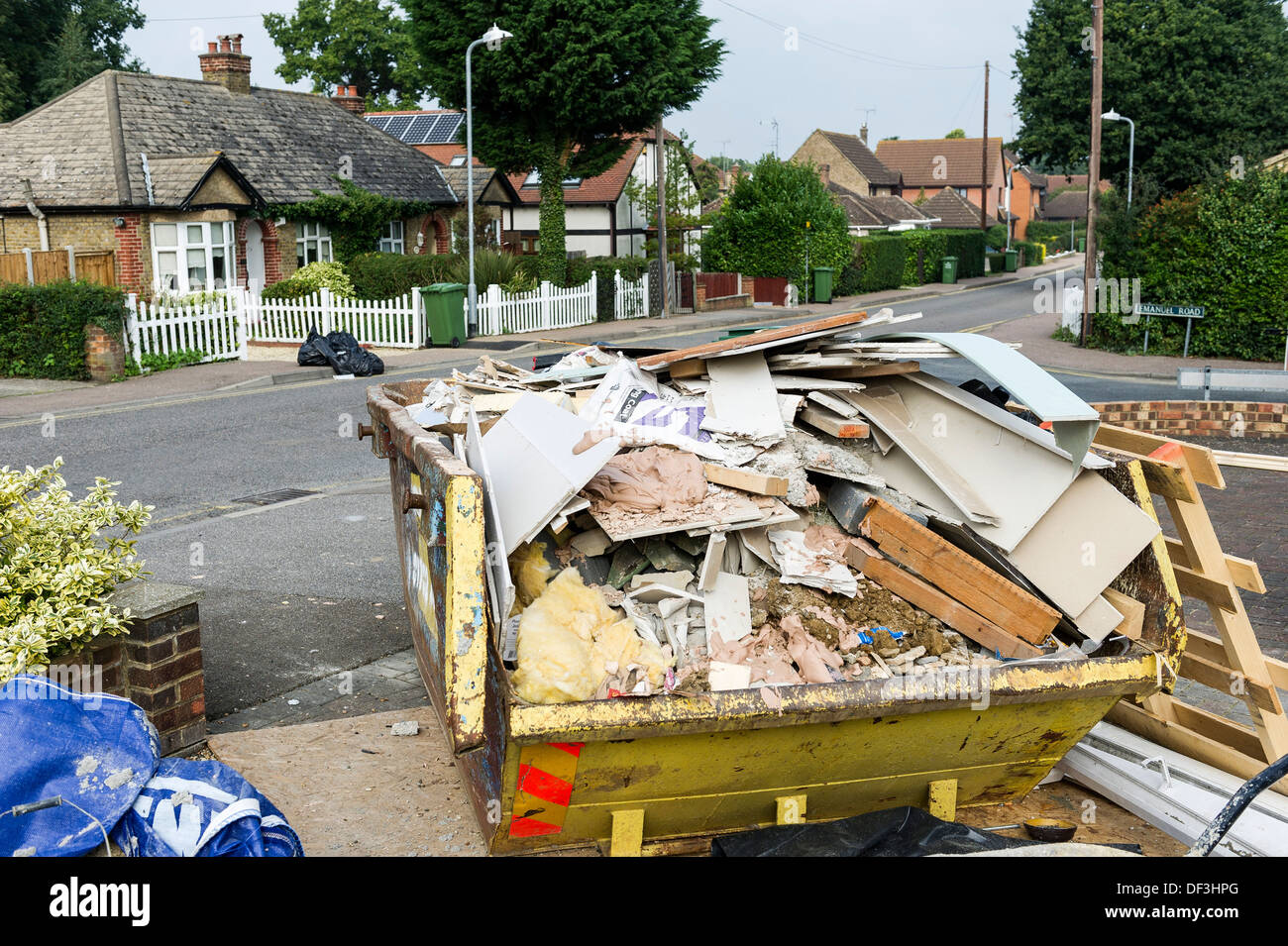 A skip full of rubble Stock Photo - Alamy